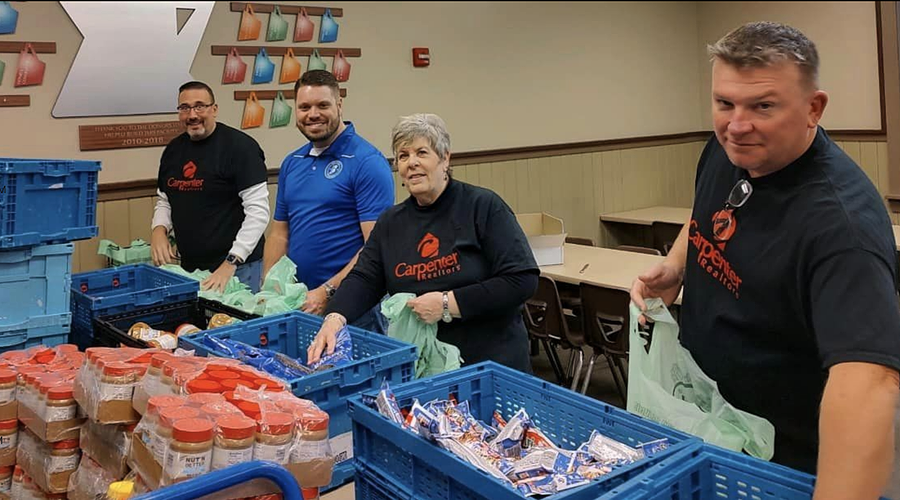 Kyle Dougherty Helps Community Kitchen's Backpack Buddies Program